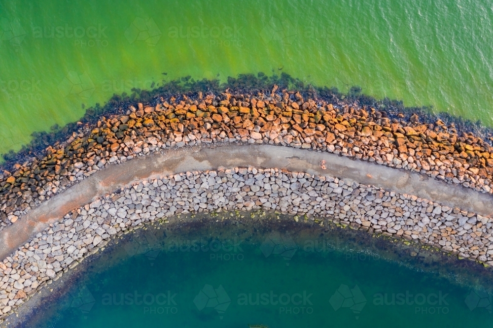 Image of Looking straight down on a curved section of a breakwater with ...