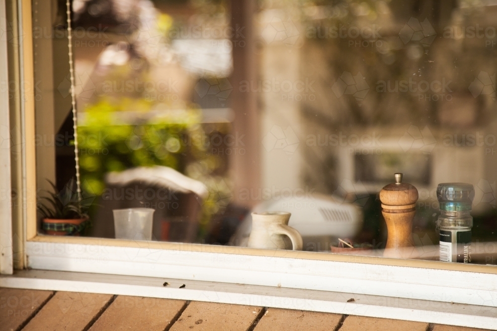 Image of Looking through kitchen window of home - Austockphoto