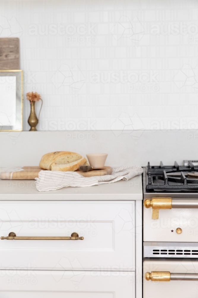Image of Lovely White kitchen with shaker profile and brass accents ...