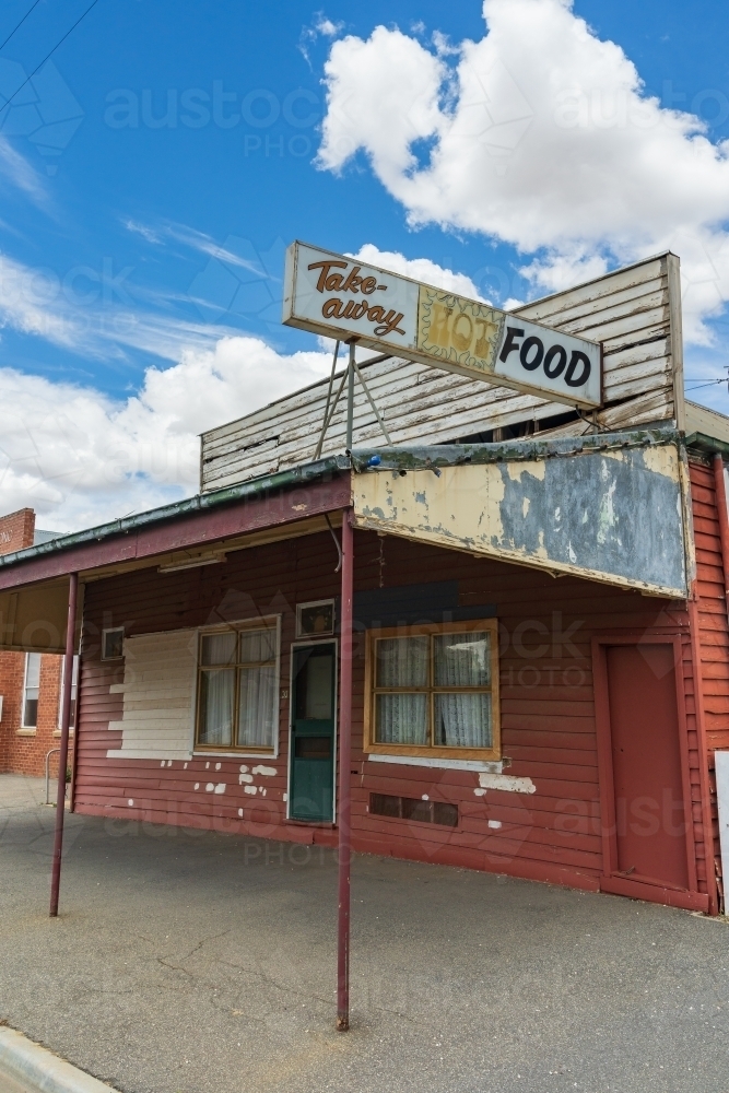 Image of Low angled view of a disused take away food store in a rural ...