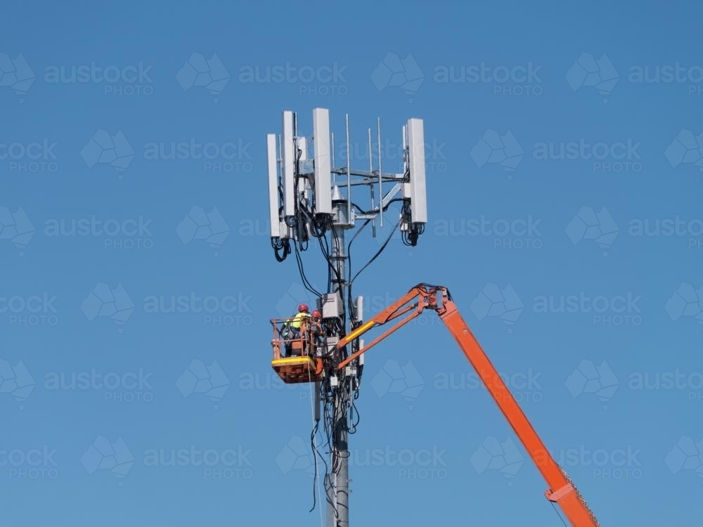 Image of Maintenance on a mobile phone tower - Austockphoto