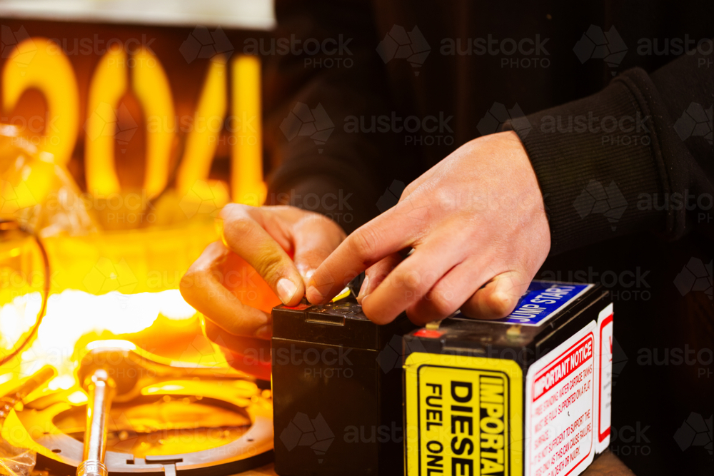 Image of Male mechanic hand working on wiring testing light with ...