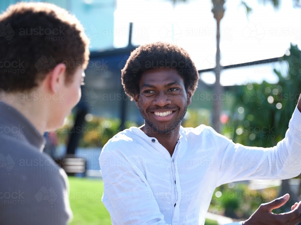 Image of Man and woman having a conversation outside - Austockphoto