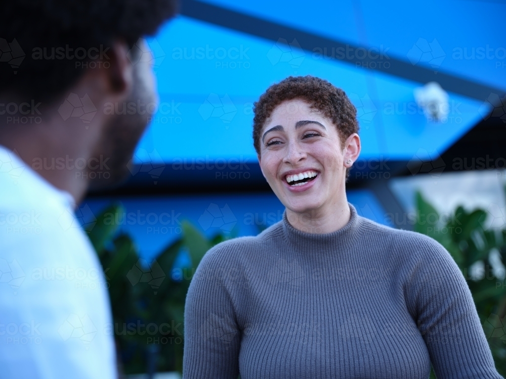 Image of Man and woman having a conversation outside - Austockphoto