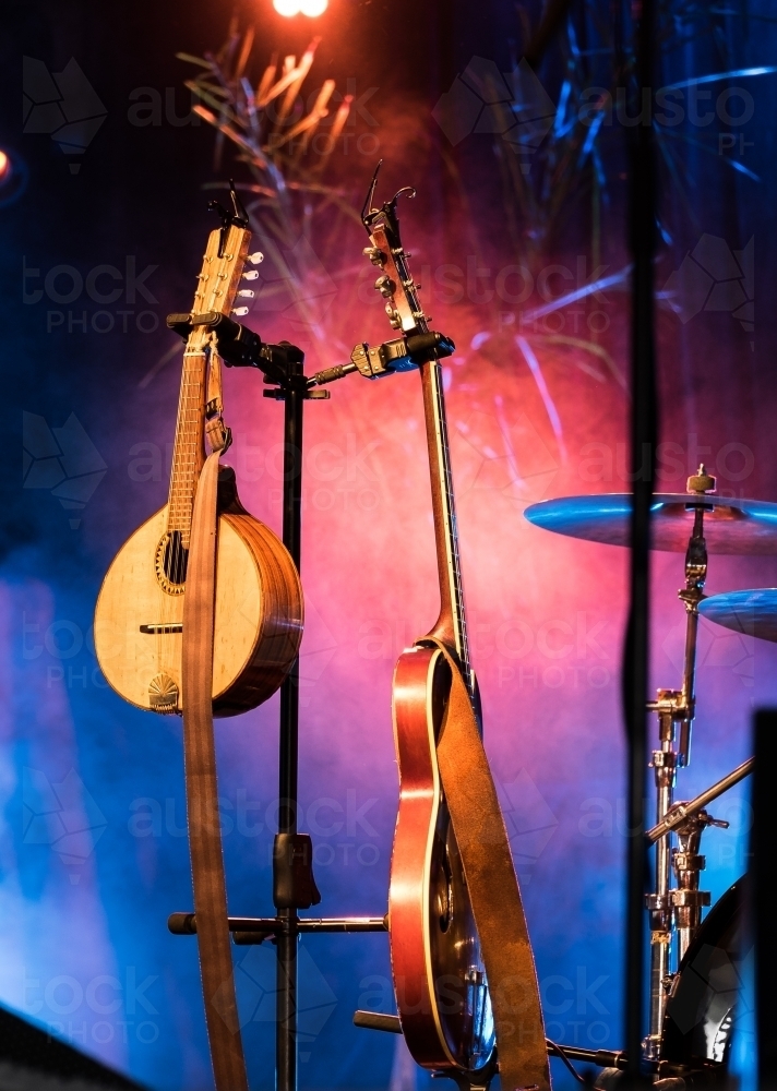 Image of Mandolin and guitar on stage ready for the musicians ...