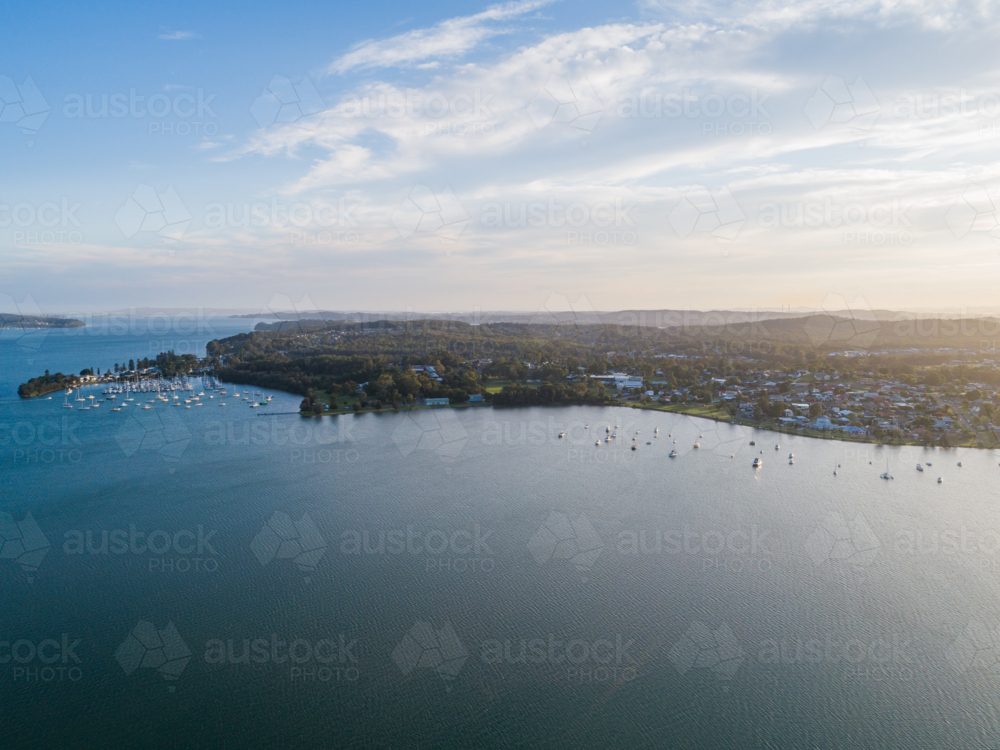Image of marina seen across water of Cockle bay in Lake Macquarie from ...