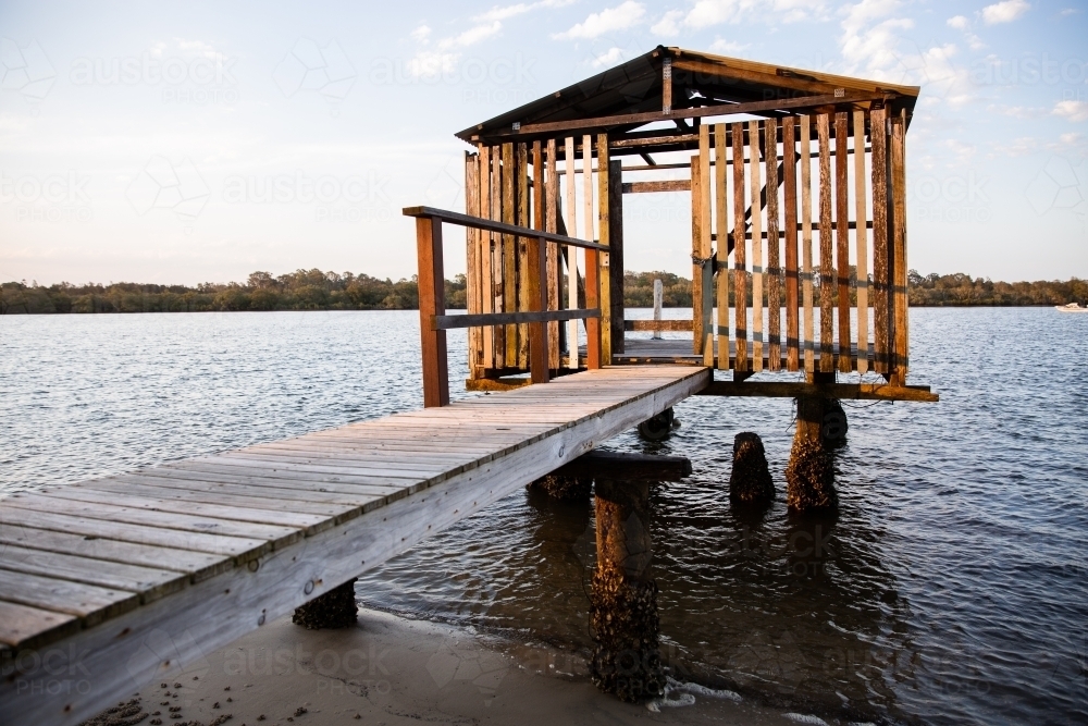 Image of Maroochy river boat house and jetty in afternoon light ...