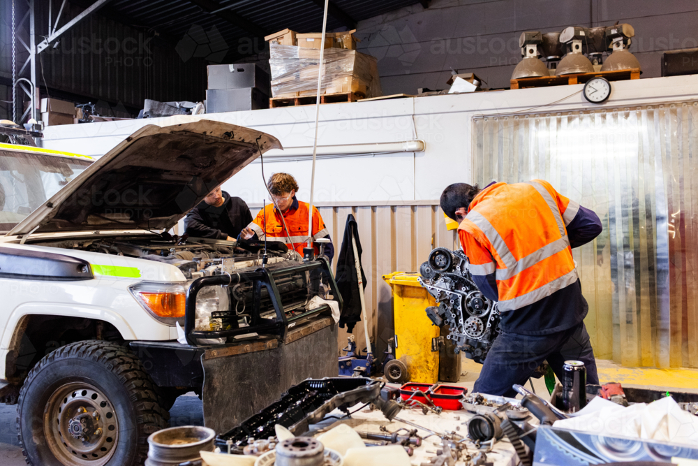 Image of Mechanics diagnosing and repairing vehicle internal engine ...