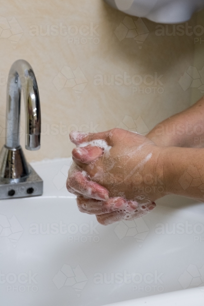 Image of Medical hand washing in hospital - Austockphoto