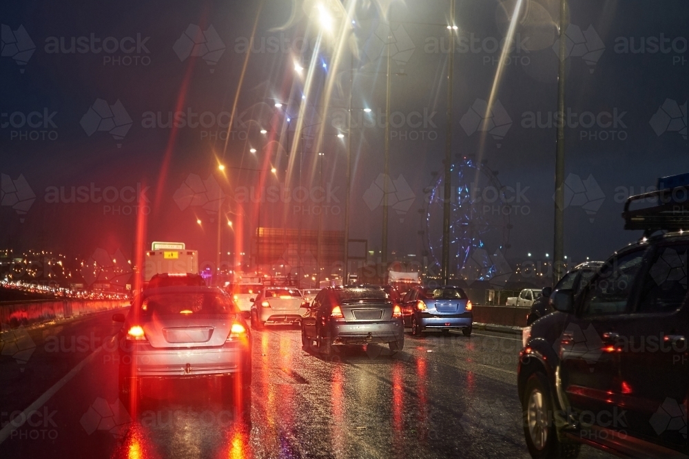Image of Melbourne freeway traffic on a rainy night - Austockphoto