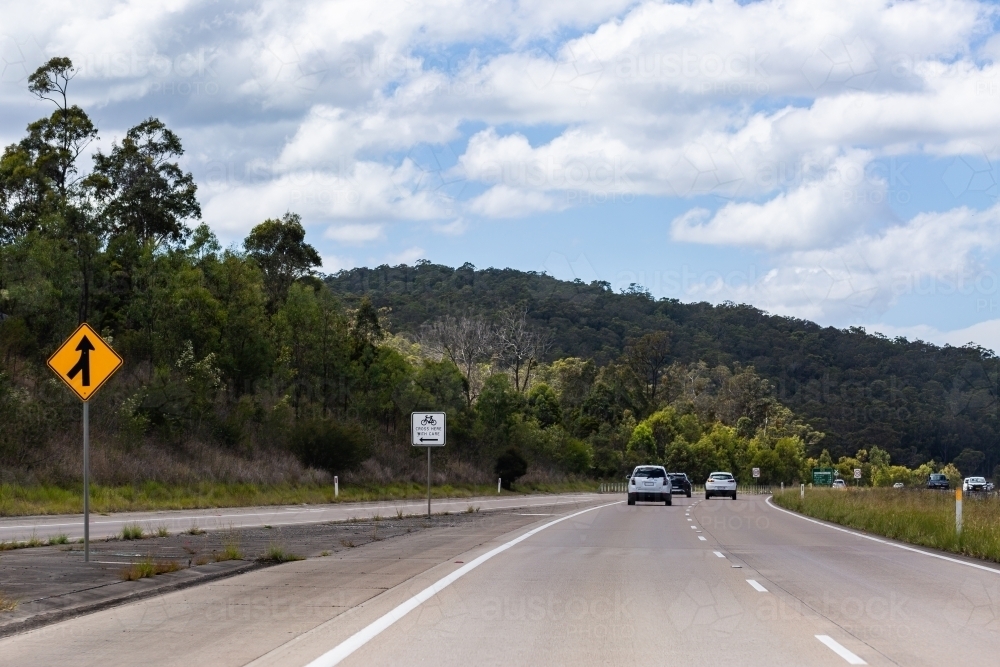 Image of Merging onto highway lane for cars and sign about cyclists ...