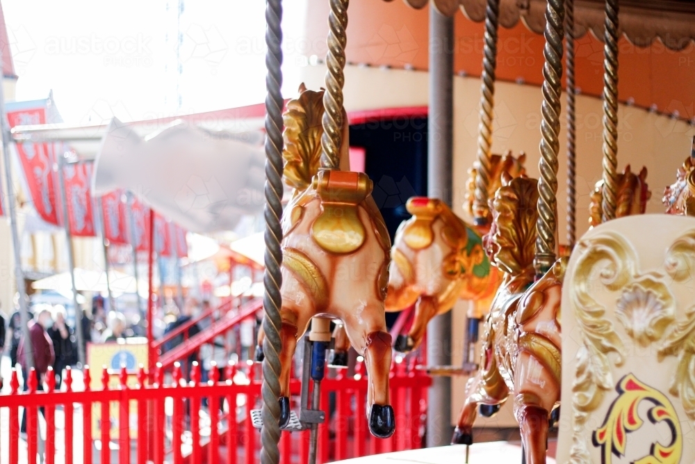 Image of Merry-go-round horses at a theme park - Austockphoto