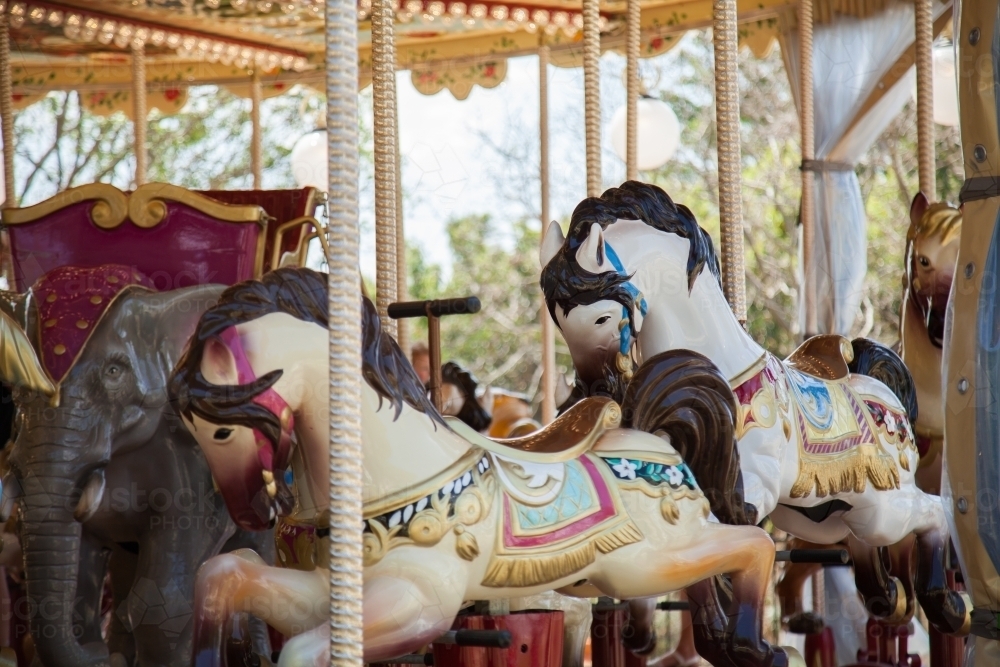 Image of Merry go round horses on a - Austockphoto