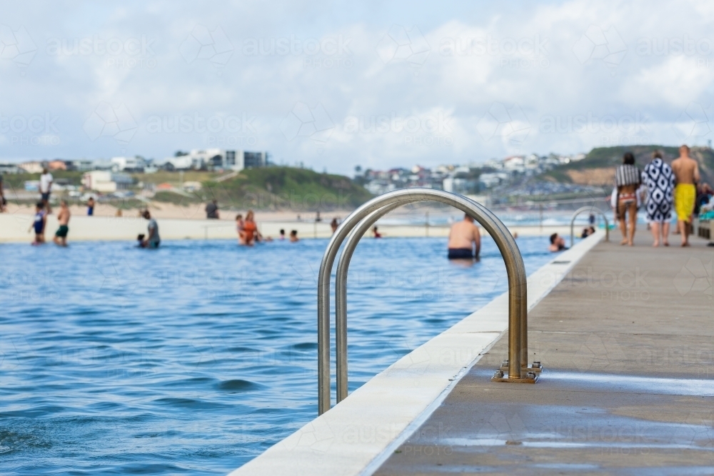 Image of metal handrails and steps down to public ocean baths pool ...