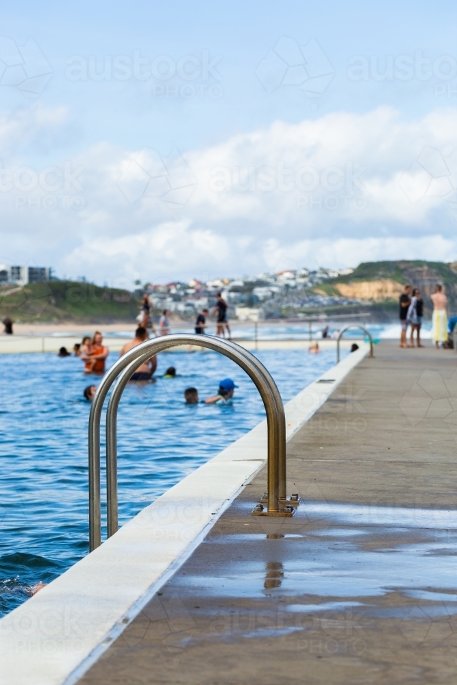 Image of metal handrails and steps down to public ocean baths pool ...