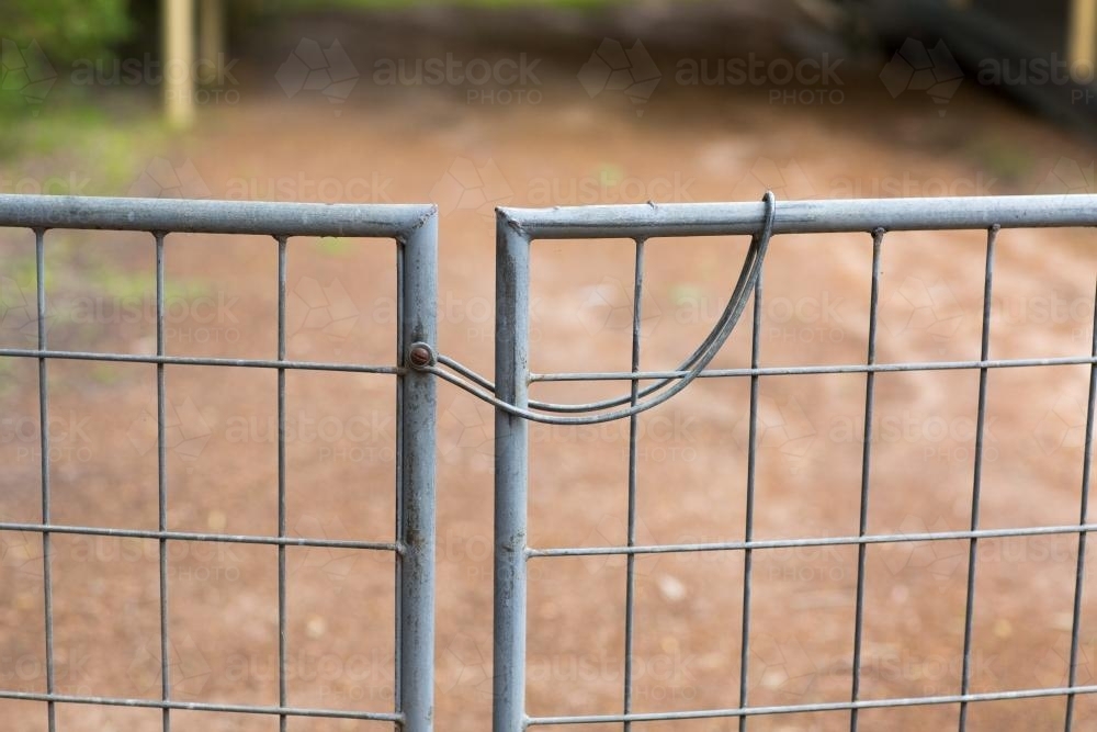 Image of Metal latch on unlocked gate - Austockphoto
