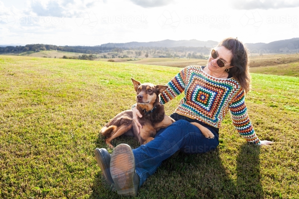 Image of middle age country woman relaxing on green lawn grass with her ...
