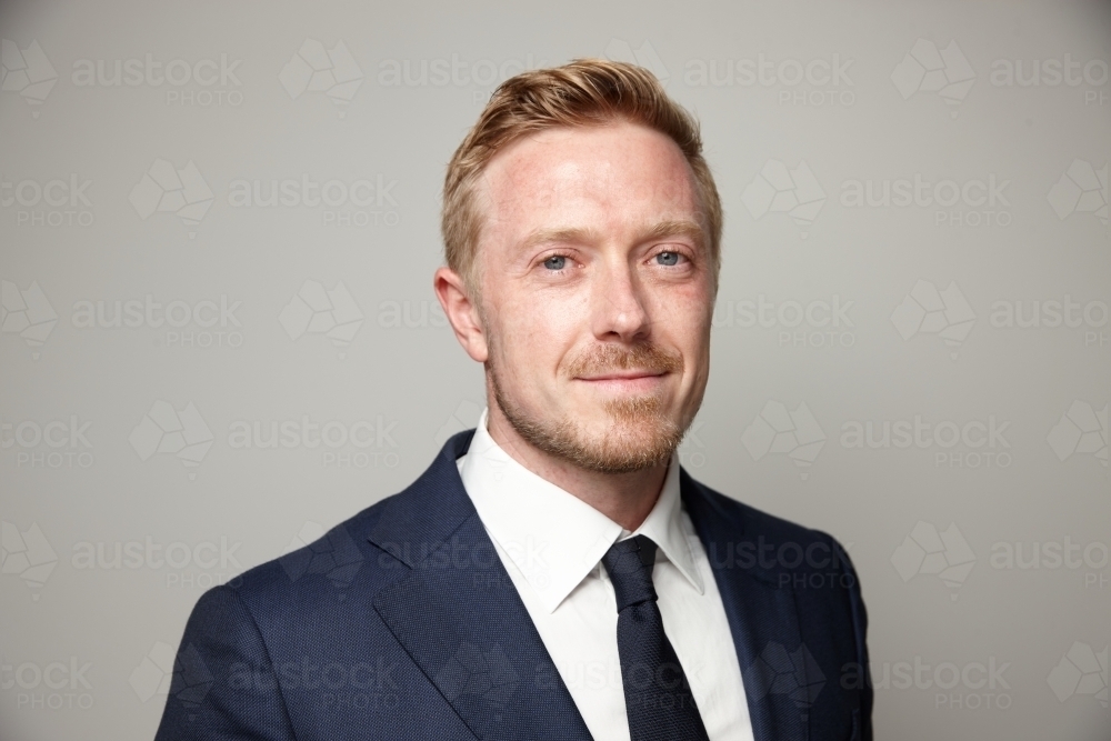 Image of middle aged man wearing suit and tie - Austockphoto
