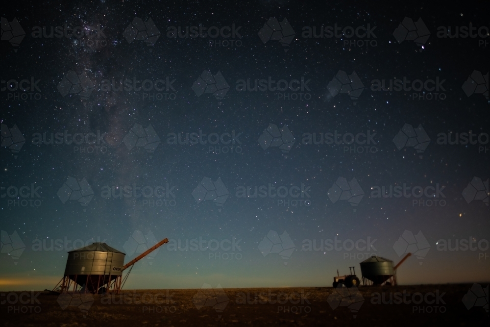 Image of Milky Way setting behind two farming containers in the ...