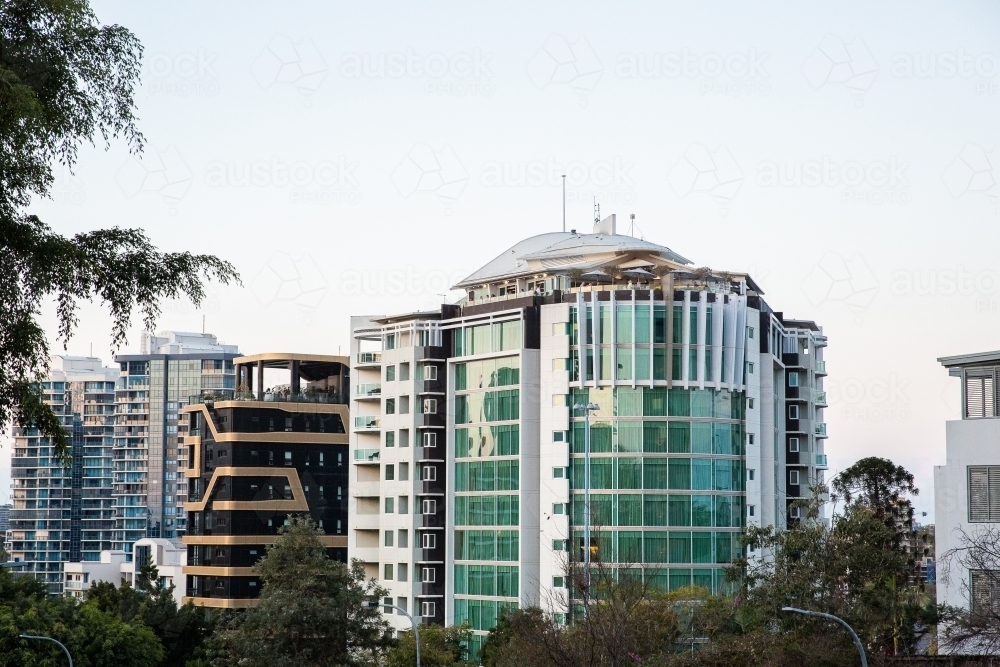 Image of modern apartment buildings in Brisbane city - Austockphoto