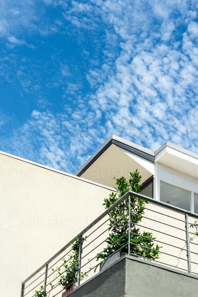 Image of modern generic white apartment building against blue sky ...