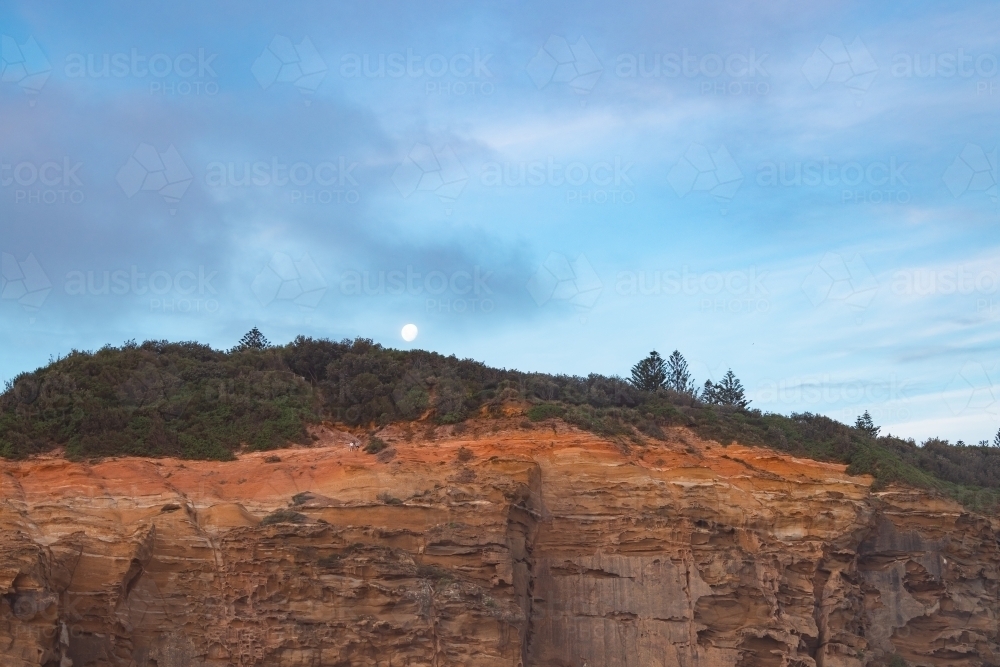 Image of Moon rising over cliff at Redhead Beach, Newcastle NSW ...