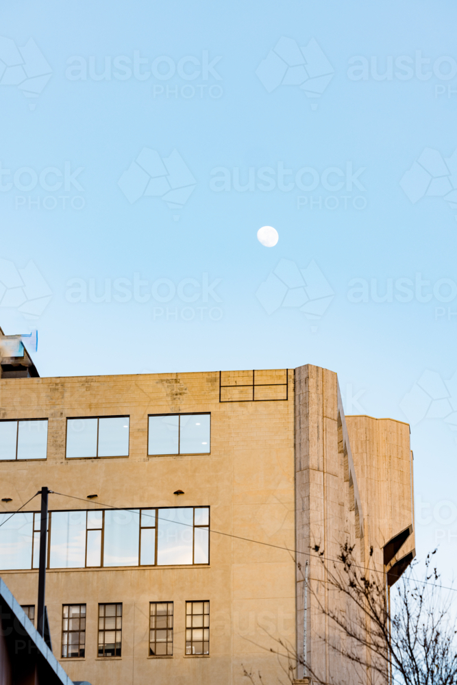 Image of Moon visible in the daytime above tall buildings in Adelaide ...