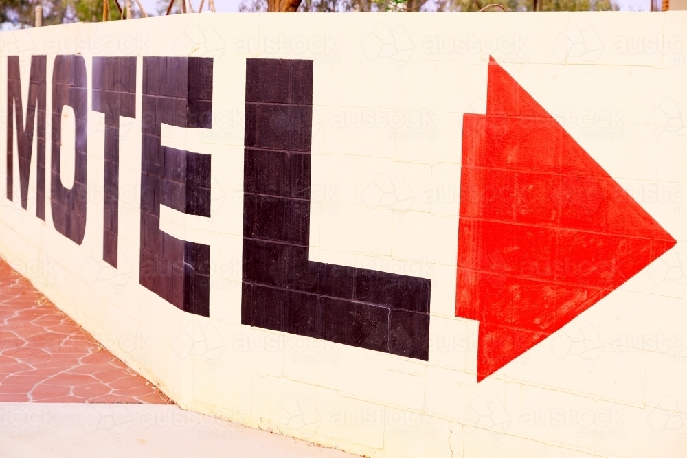 Image of Motel sign on brick wall. - Austockphoto