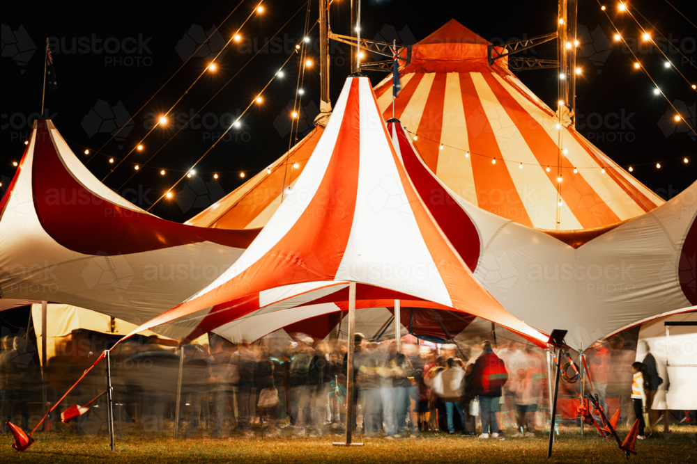 Image of Motion blur crowd of people outside big top circus tent at ...
