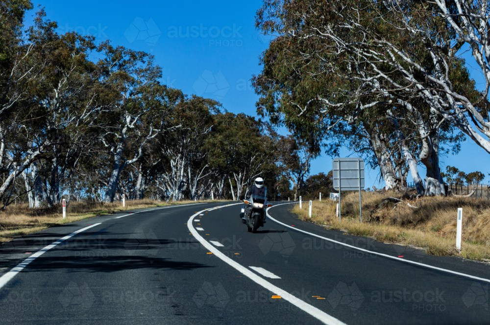 Image of motorbike riding along New England Highway road in rural ...