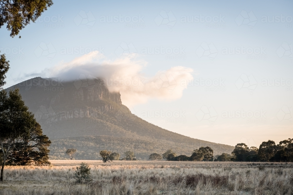 Image of Mount Sturgeon under cloud. - Austockphoto