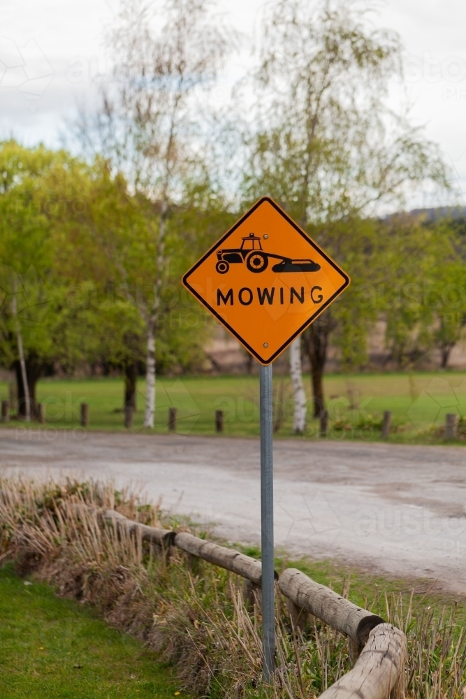 Image of Mowing sign in permanent place in parkland - Austockphoto