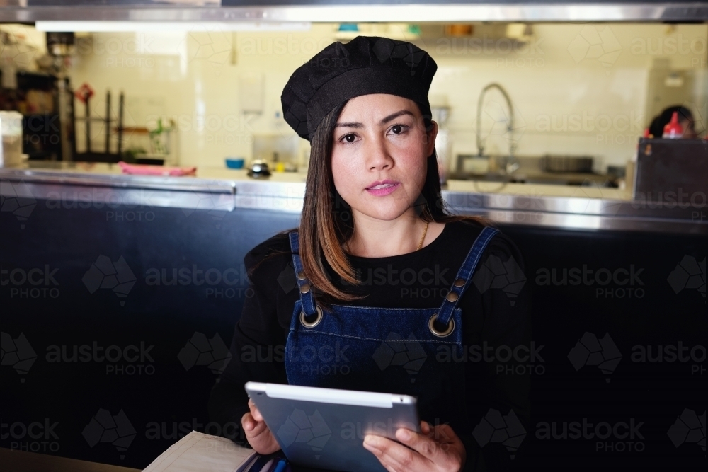 Image of Multicultural Asian waitress taking order at Thai restaurant ...
