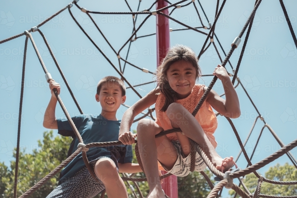 Image of multicultural kids having fun at playground - Austockphoto