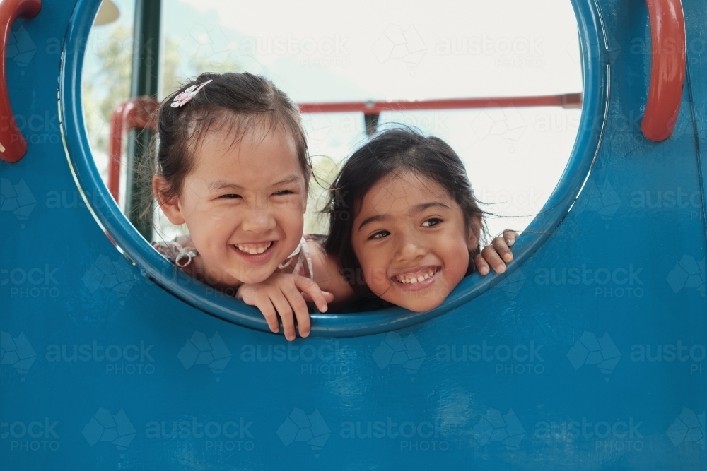 Multicultural Kids Playing On Playground