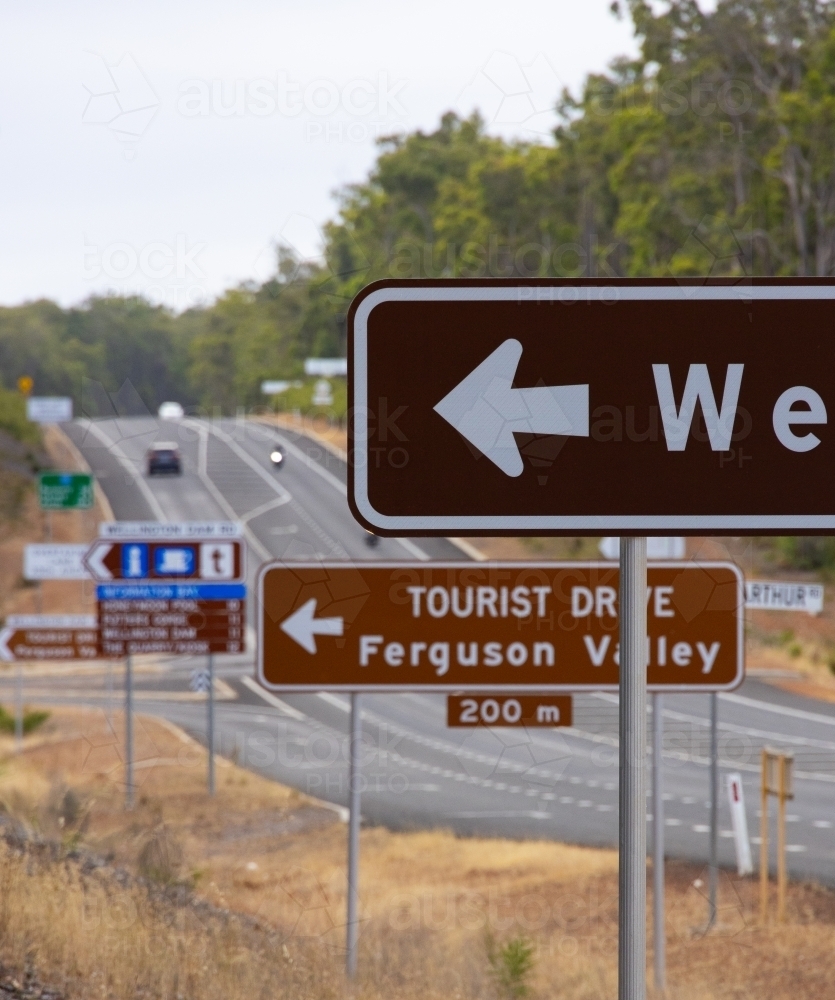 Image of multitude of road signs on highway at intersection of Ferguson ...