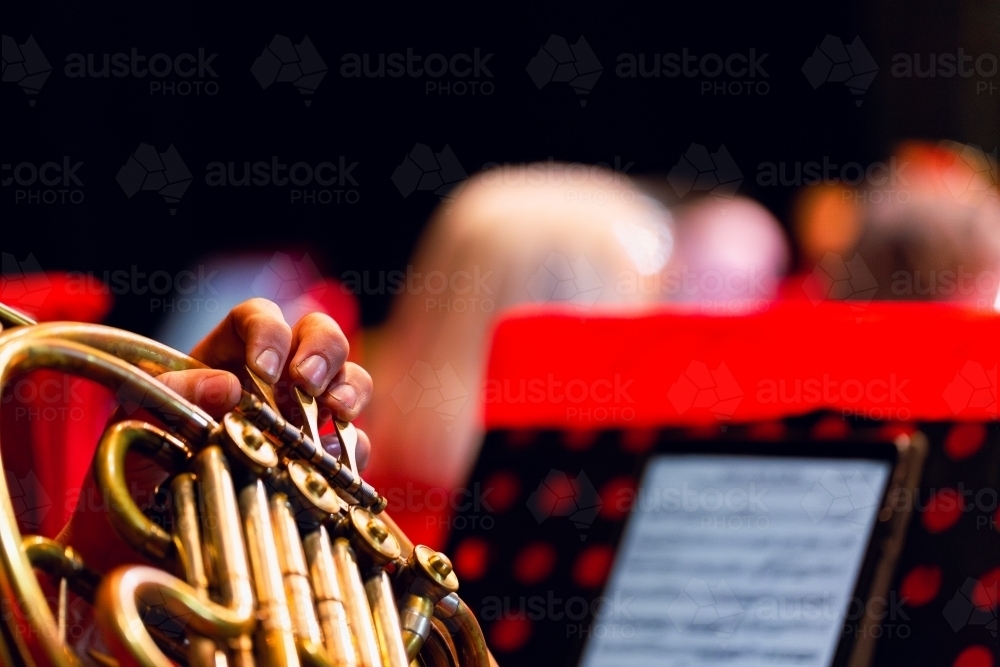 Image of Musicians fingers on brass instrument at concert - Austockphoto
