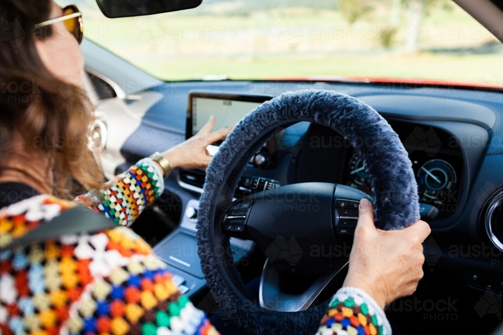 Image of Navigation GPS System in electric vehicle car with woman's ...