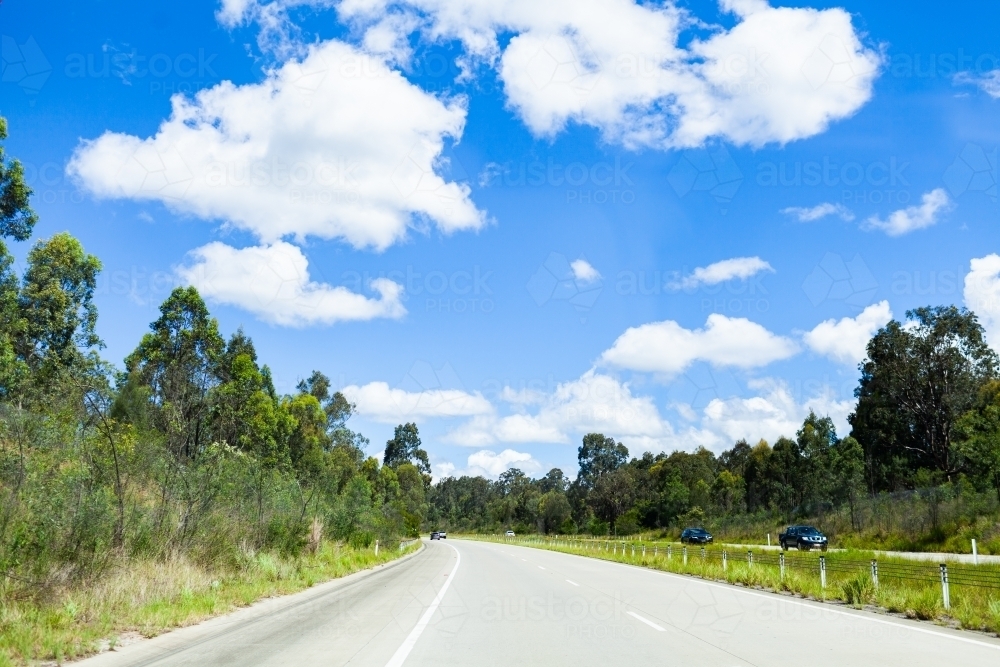 Image of New England highway in bright sunlight - Austockphoto