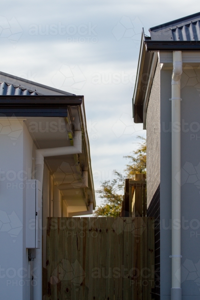 Image of New homes built very close to each other. - Austockphoto