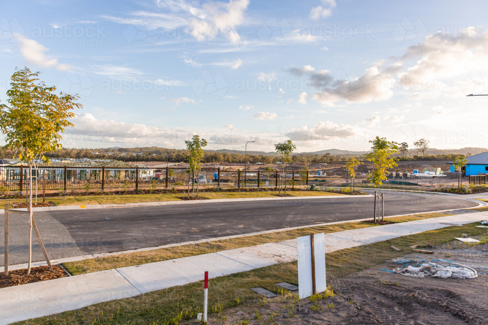 Image of new housing estate with street, foot paths, landscaping and ...