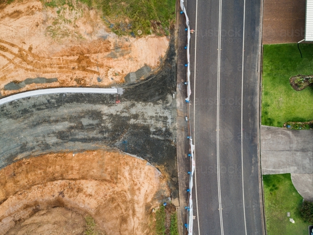 Image of New road and housing area under development - Austockphoto