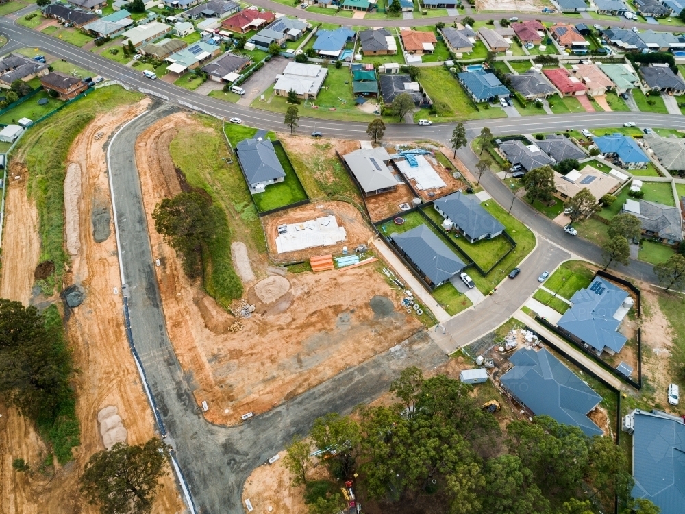 Image of New road and housing area under development - Austockphoto