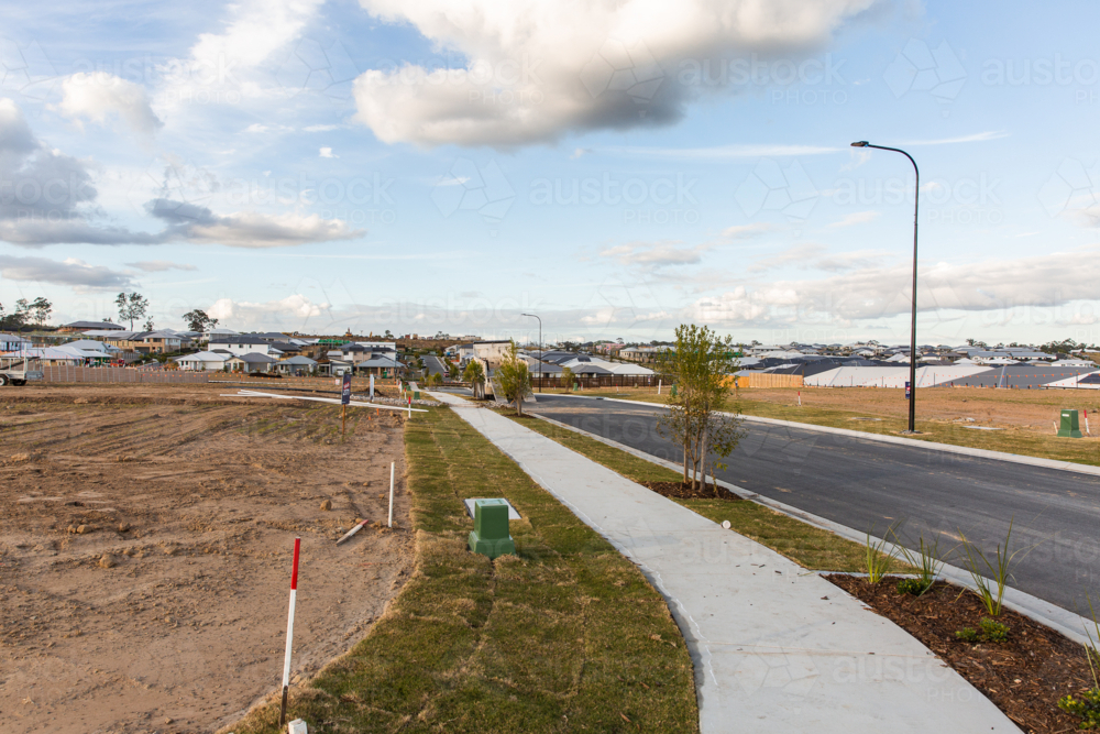 Image of new streets, paths, landscaping and blocks of land in a new ...