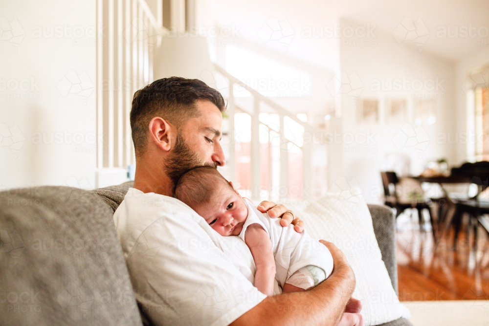 Image of Newborn baby boy resting on fathers chest - Austockphoto