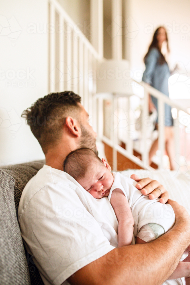 Image of Newborn baby boy sleeping on fathers chest - Austockphoto