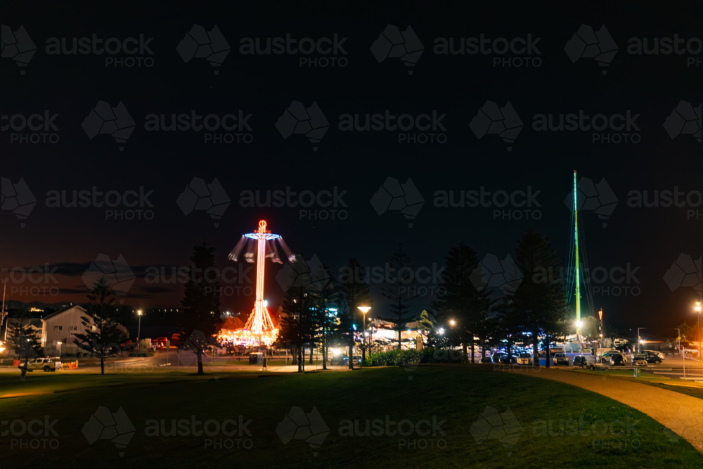 Image of Newcastle skyline illuminated by vibrant carnival rides at ...