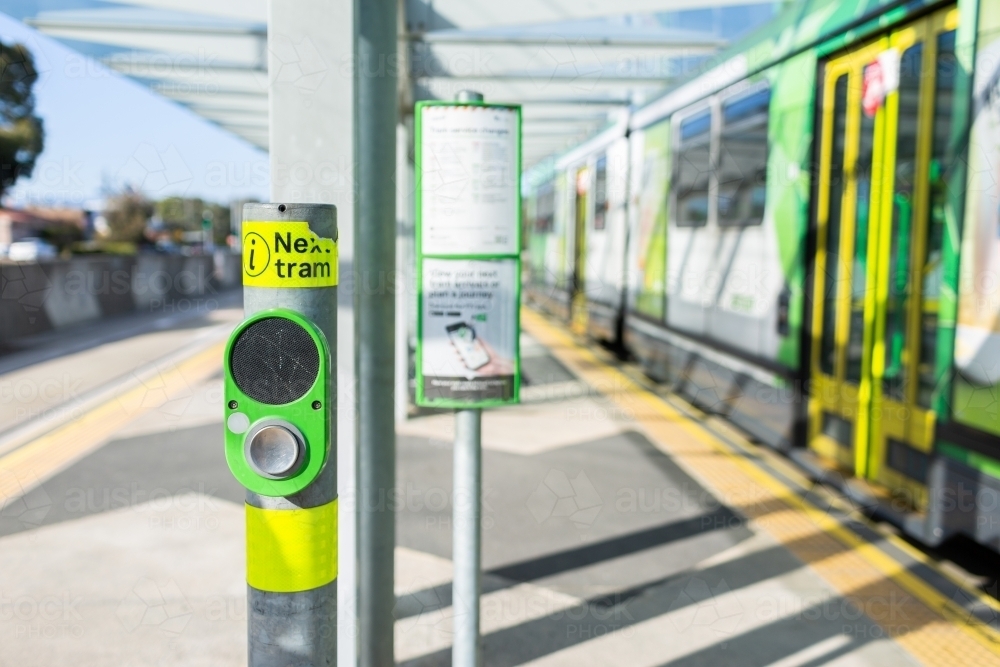 Image of next tram button at station in city suburb - Austockphoto