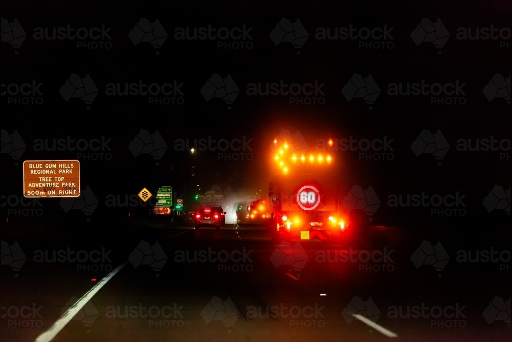 Image of Night roadwork on highway road - Austockphoto
