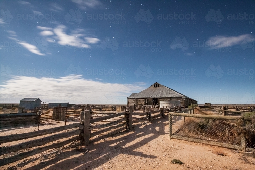 Image of Nighttime photo of a timber shearing shed and cattle yards in ...